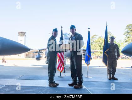 Col. Kurt Helphinstine, left, 4th Fighter Wing commander, presents Maj ...