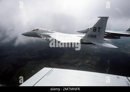 A left side view of an F-15 Eagle aircraft as it takes off. The ...