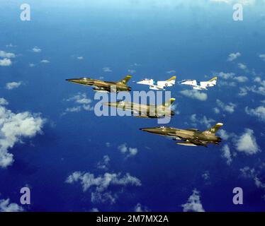 Two Fleet Composite Squadron 5 (VC-5) A-4E Skyhawk aircraft fly over ...