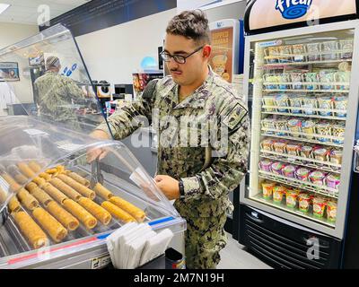 GUAM (May 12, 2022) -- From left, Capt. Steven Wasson; Capt. John Bub ...