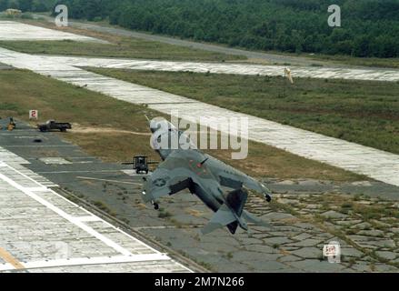 A rear view of an AV-8A Harrier aircraft taking off from the amphibious ...