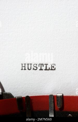 Hustle word written with a typewriter Stock Photo - Alamy