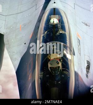 An air-to-air overhead view of an F-16B Fighting Falcon aircraft with ...