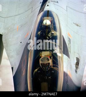 An air-to-air overhead view of an F-16B Fighting Falcon aircraft with ...