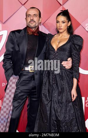 Andreas Kronthaler and Cora Corre pose for photographers upon arrival ...