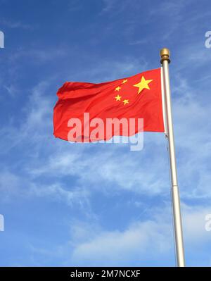Chinese flag against blue sky Stock Photo - Alamy