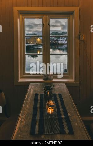 Nusfjord, window with view outside, sun rays, fishing village, Lofoten ...
