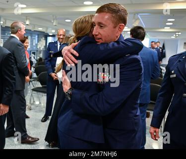 Capt. Taylor Bye and Air Force Chief of Staff Gen. CQ Brown, Jr. sing ...