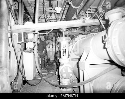 An interior view of the engine room on the guided missile frigate USS ...