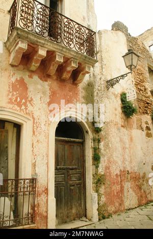 Neglected facade of a building in the historical center of Racale ...