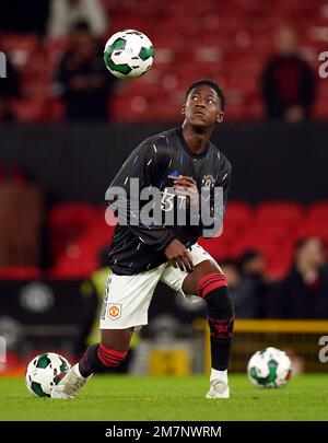 Manchester United's Kobbie Mainoo warms up ahead of the Premier League ...
