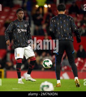 Manchester United's Kobbie Mainoo warms up ahead of the Premier League ...