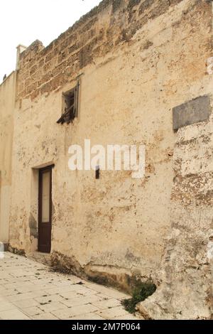 Neglected facade of a building in the historical center of Racale ...
