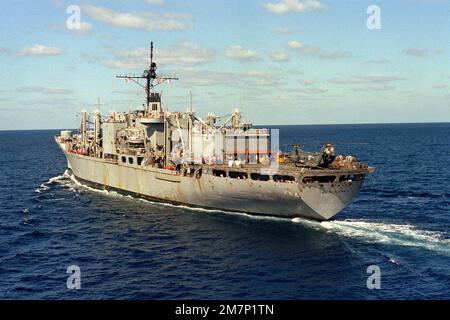 A port quarter view of the combat stores ship USNS MARS (T-AFS-1) and the nuclear-powered guided ...