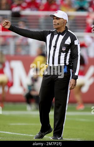 NFL referee Tra Blake (3) during a play review in the first half an NFL ...