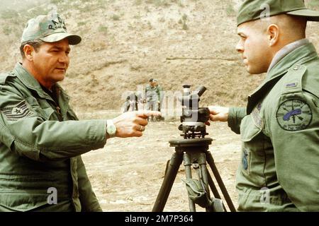 51st Security Police Squadron member SSGT Robert Colyer packs a white ...