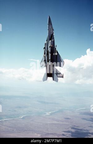 AN air-to-air left side view of an F-15 Eagle aircraft in flight over ...