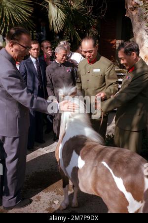 Vice Premier Geng Biao, People's Republic of China, sits in the captain ...