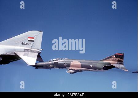 An F-4E Phantom II aircraft, foreground, and other Phantom aircraft of ...