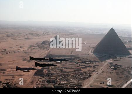 A right side view of four F-4E Phantom II aircraft flying in formation ...