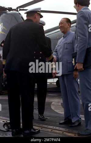Vice Premier Geng Biao, People's Republic of China, sits in the captain ...