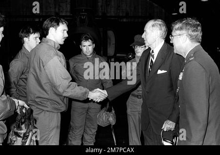 Deputy Secretary of Defense Graham Claytor greets an F-4 Phantom II ...