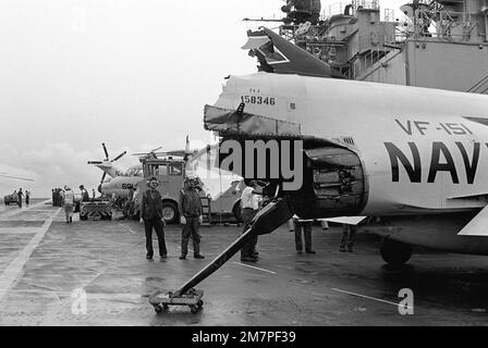 A view of the damaged tail section of an F-4J Phantom II aircraft on ...