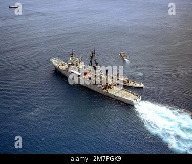 The salvage and rescue ship USS BRUNSWICK (ATS-3) tows the small ...