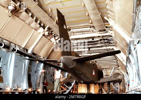 A U-21 Beechcraft King Air A100 aircraft is loaded aboard a C-5 Galaxy ...