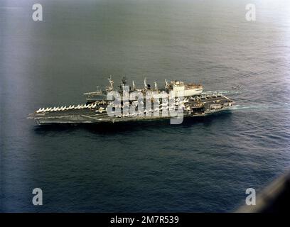 An aerial port beam view of the aircraft carrier USS MIDWAY (CV 41) and ...