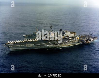 An aerial port view of the aircraft carrier USS MIDWAY (CV 41) and the ...