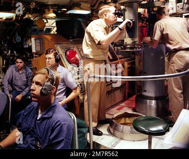 A Sturgeon class nuclear-powered attack submarine, the large harbor tug ...