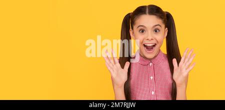 Pleasantly surprised happy kid keep mouth open yellow background ...