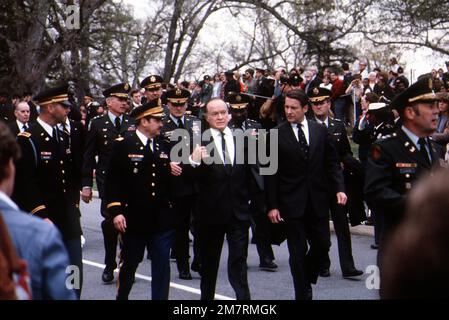 Bob Hope and joint-service officers leave the cemetery after the ...