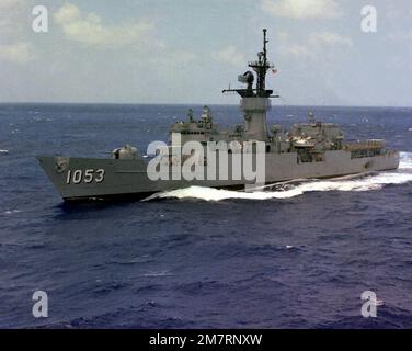 A port bow view of the frigate USS KIRK (FF 1087) entering port at ...