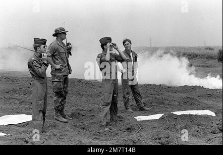 2LT Robert Reneau, 345th Tactical Airlift Squadron, communicates with a ...