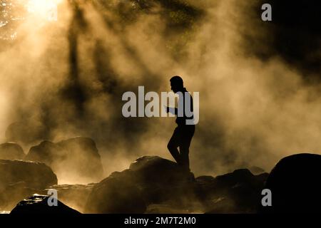 January 8, 2023; Hot springs and fog in Thailand with morning sunlight ...