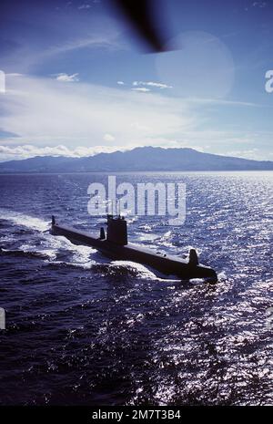 A high-angle starboard bow view of the Spruance class destroyer USS ...