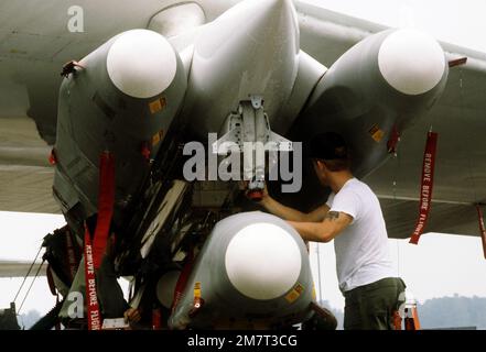 A missile crewman from the 416th Bomb Wing, tests the power cord after ...