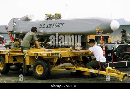 The missile crew from the 416th Bomb Wing, position an Air-Launched ...