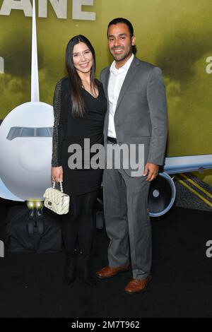 Rose Eshay and Ricky Robles Cruz attend the "Plane" New York premiere ...