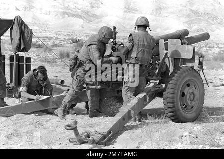 Marines from Btry. R, 5th Bn., 11th Marines, stand aboard their M-110A2 ...