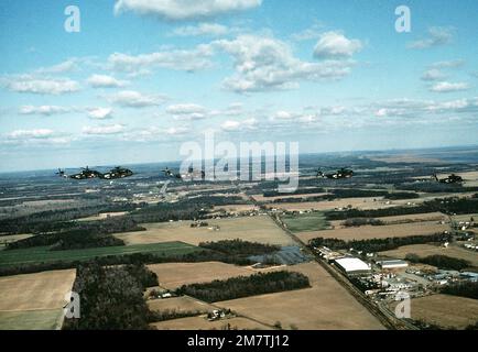 An air-to-air right view of an RH-53D Sea Stallion helicopter towing a ...