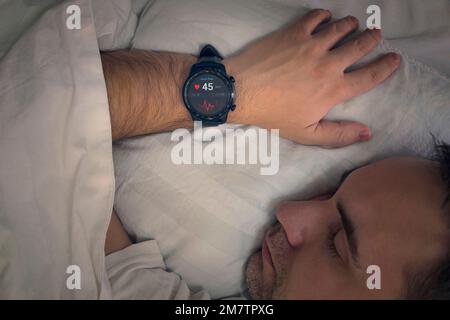 Wearable Sleep Tracking Heart Rate Monitor Smartwatch In Bed Stock ...