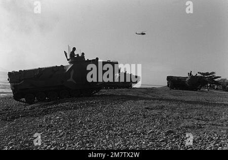 A Marine Corps LVTP-7 personnel tracked landing vehicle, approaches a ...