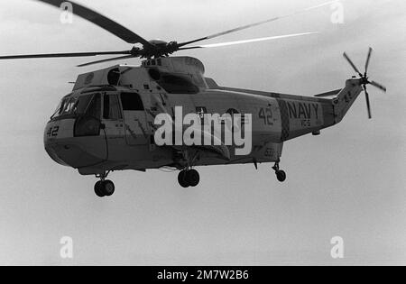 An air-to-air left front view of an SH-3 Sea King helicopter from Fleet ...