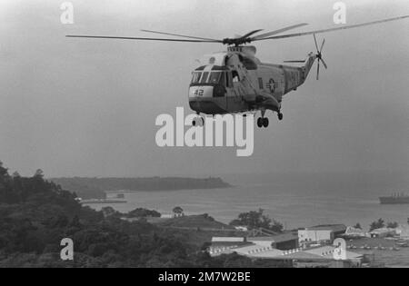 An air-to-air left front view of an SH-3 Sea King helicopter from Fleet ...