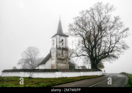 Old gothic church in Ludrova village near Ruzomberok, Slovakia. Black ...