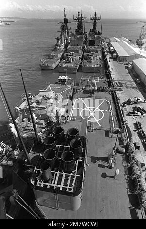 A stern view of the destroyer USS JOHN HANCOCK (DD-981) anchored during ...