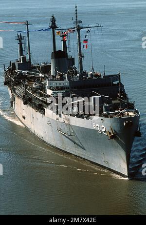 A starboard bow view of the submarine tender USS FULTON (AS 11) tied up ...